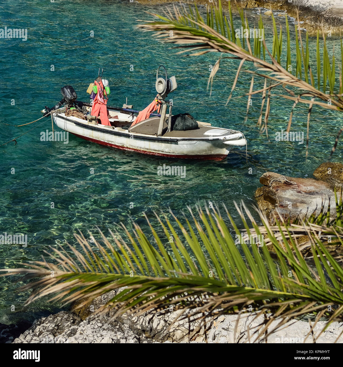 fishing boat in lonely bay Stock Photo - Alamy