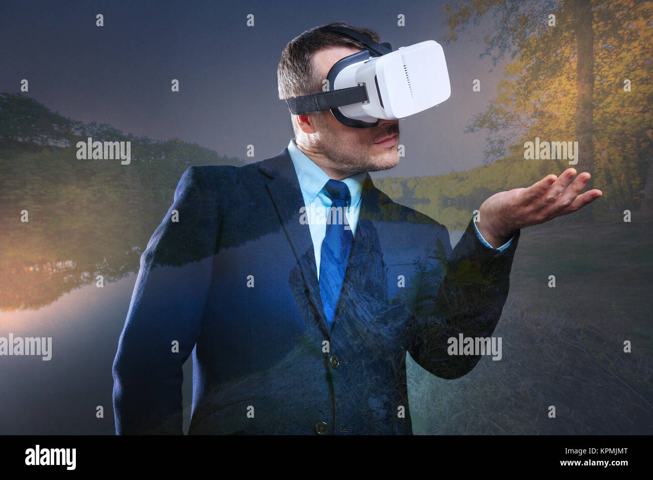 Concentrated millennial guy wearing VR headset Stock Photo - Alamy