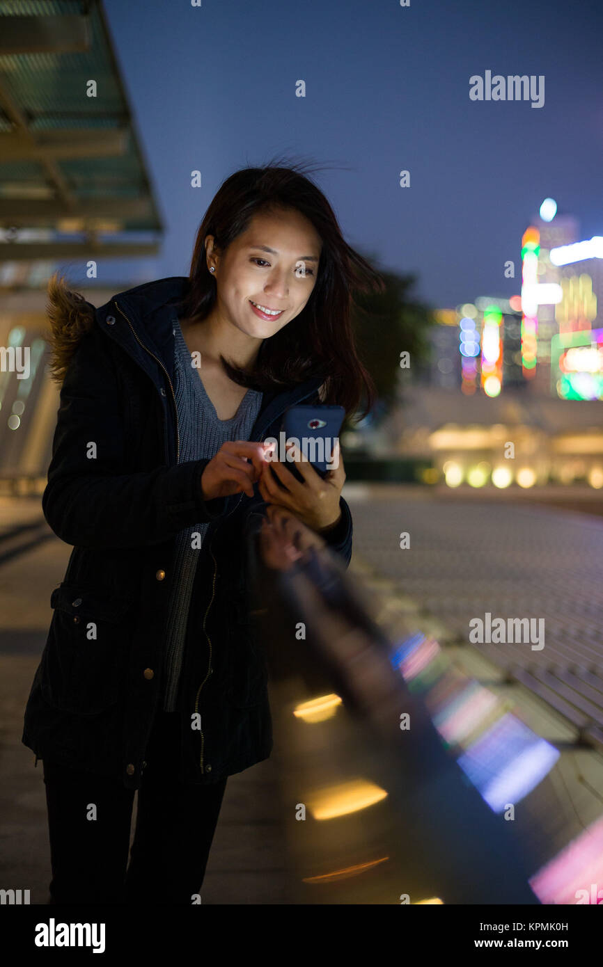 Woman use mobile phone at outdoor Stock Photo - Alamy