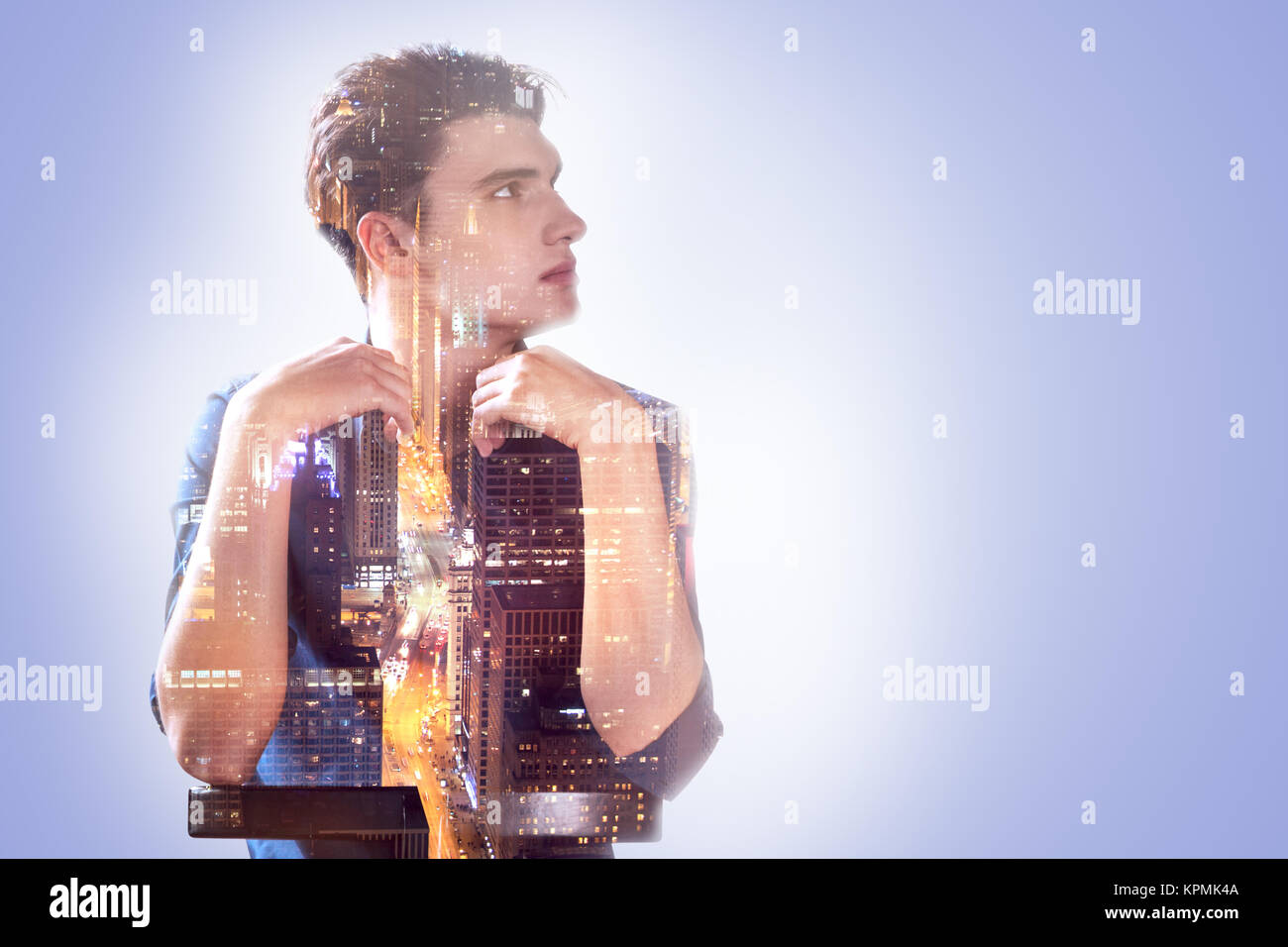 Handsome pleasant man looking aside Stock Photo - Alamy