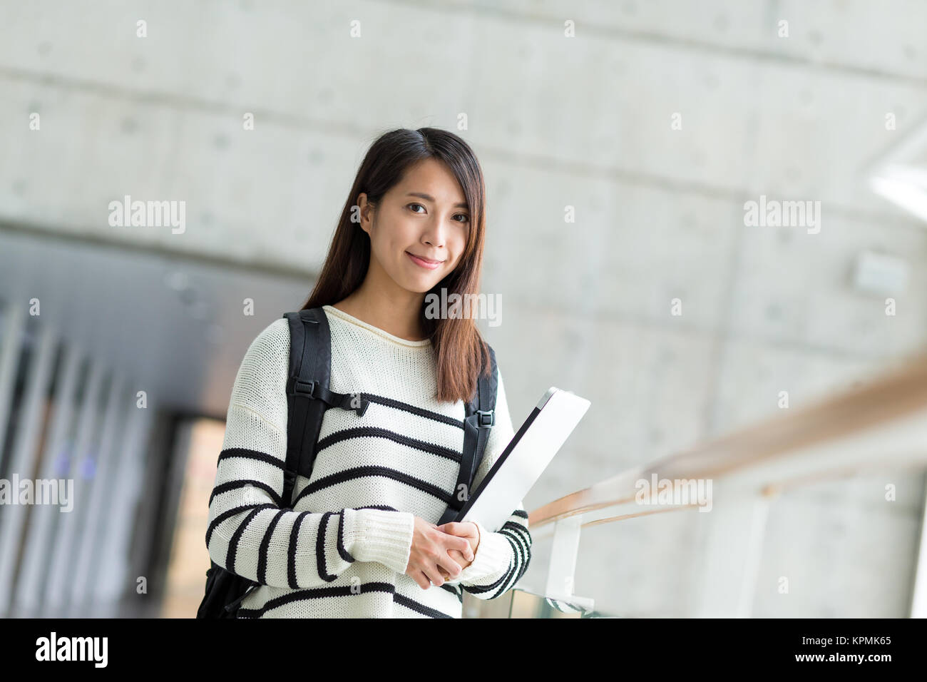 University student holding with notebook computer Stock Photo - Alamy