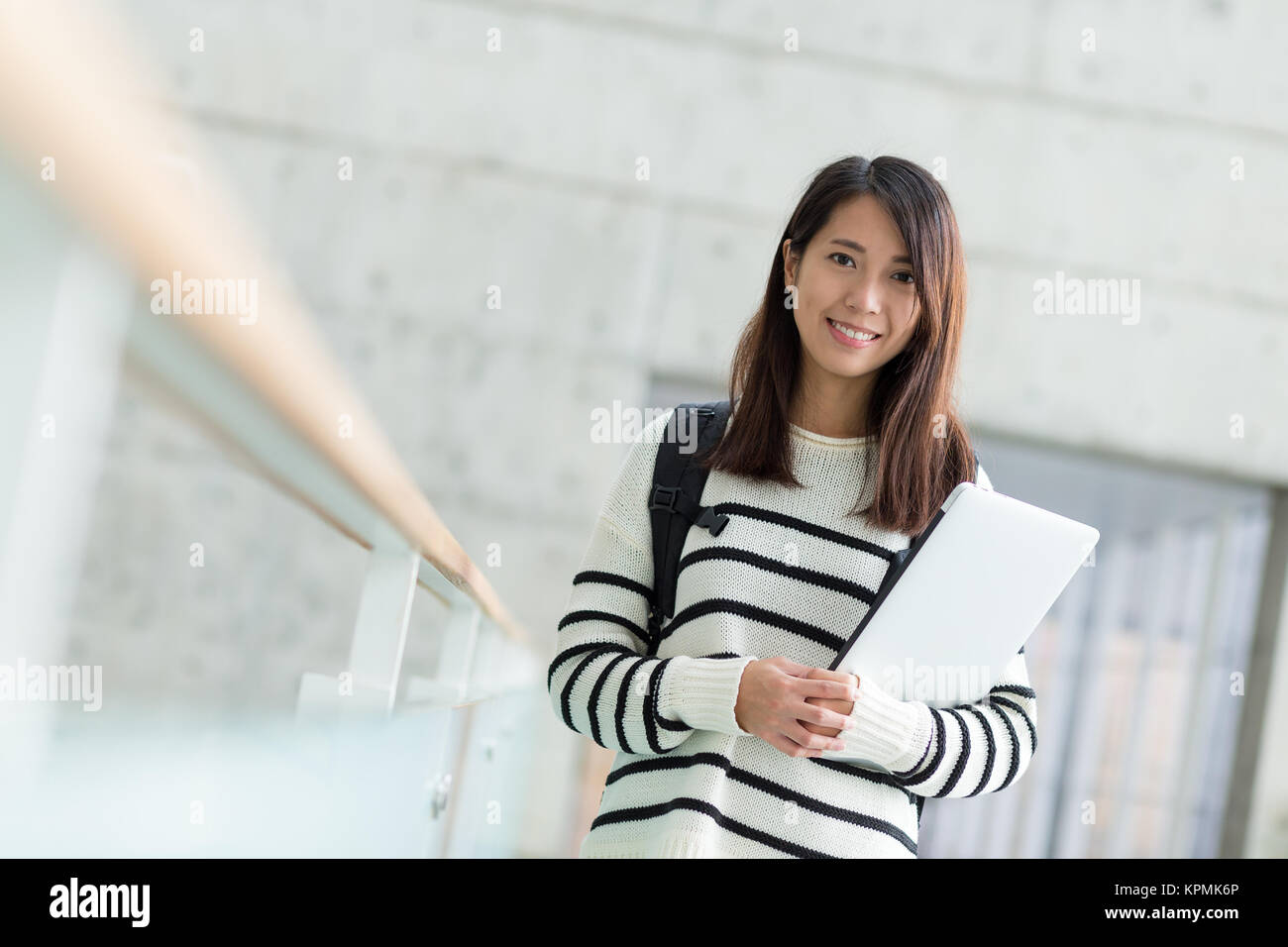 Woman hold laptop computer Stock Photo - Alamy