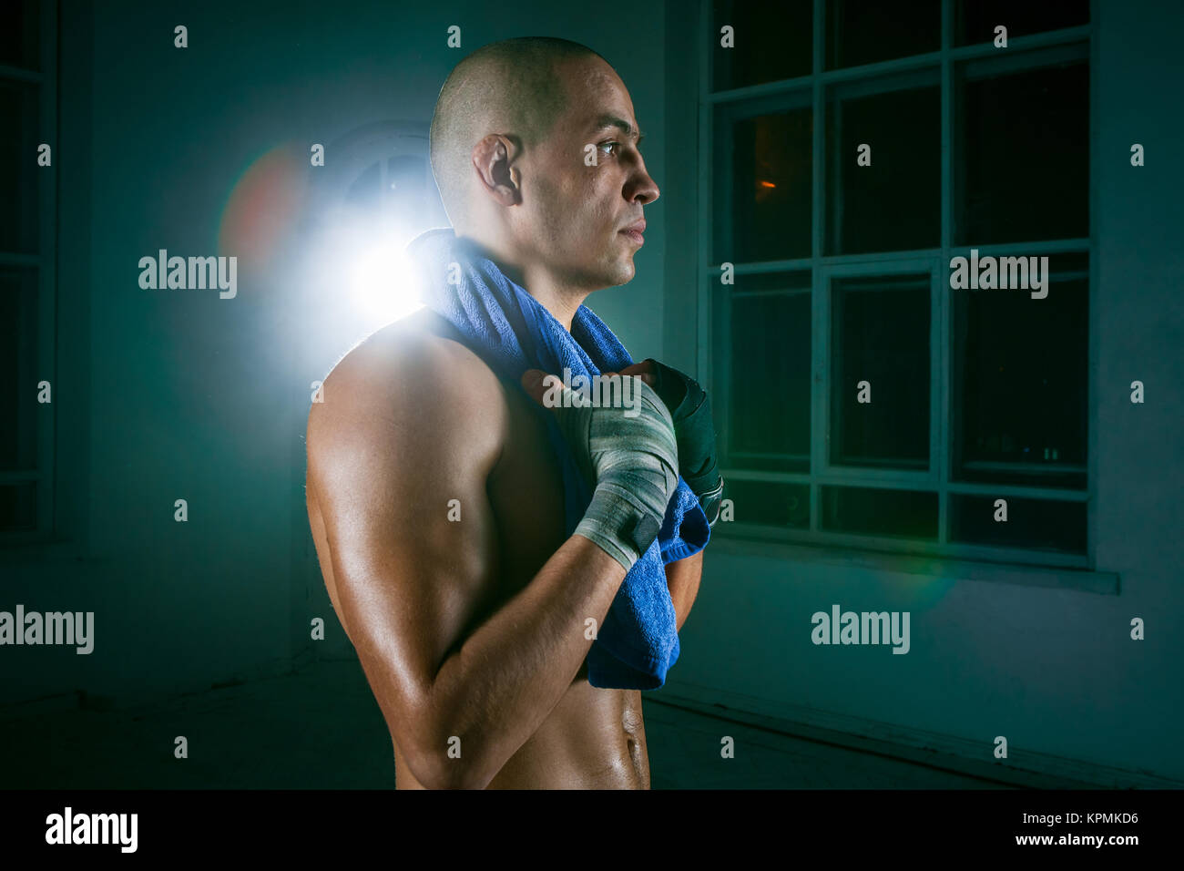 The young man kickboxing on black background Stock Photo - Alamy