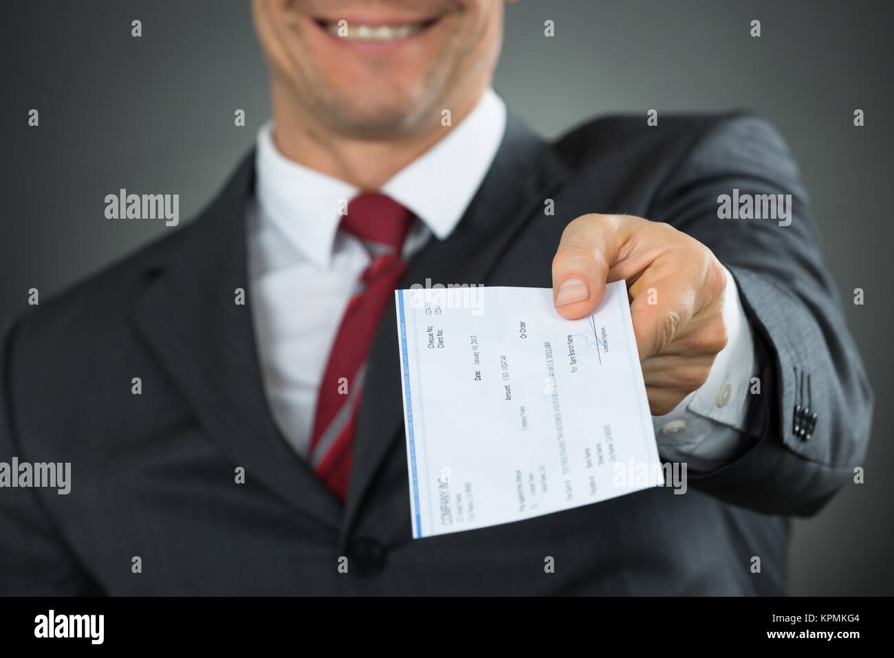 Close-up Of Businessman Hands Giving Cheque Stock Photo - Alamy