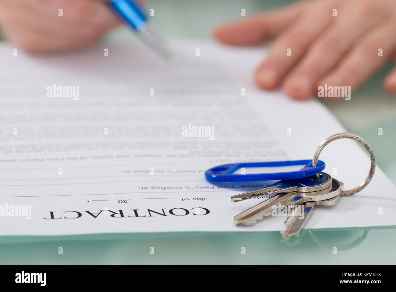 Contract With Key On Desk Stock Photo - Alamy