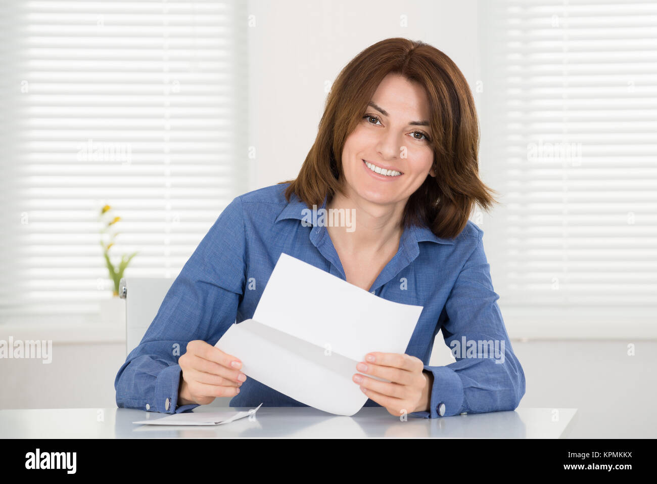 Happy Woman Reading Letter Stock Photo - Alamy