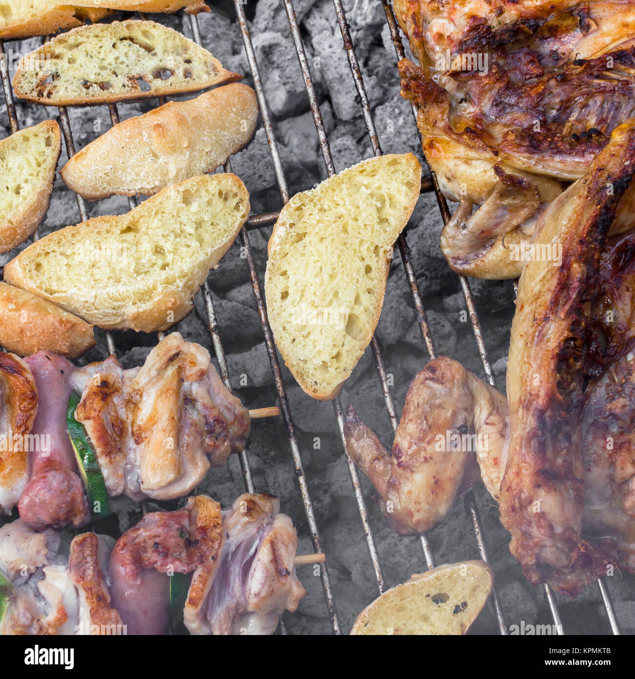 Chicken and bread on grill Stock Photo - Alamy