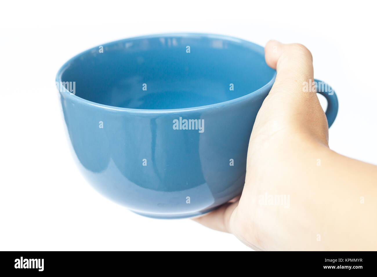 Blue ceramic bowl on white background Stock Photo - Alamy
