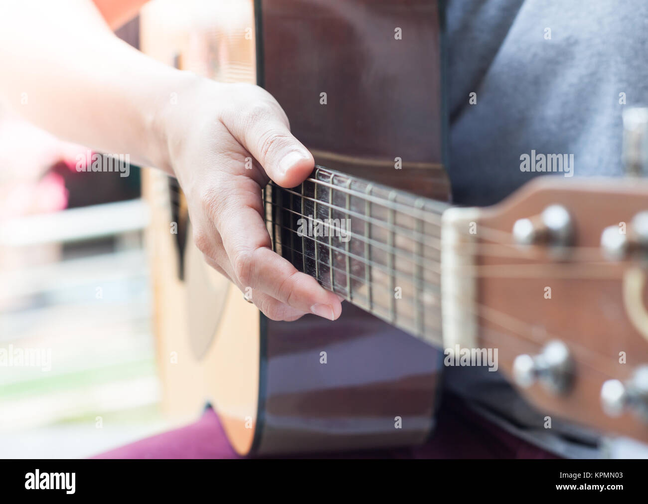 Woman's hands playing acoustic guitar Stock Photo - Alamy