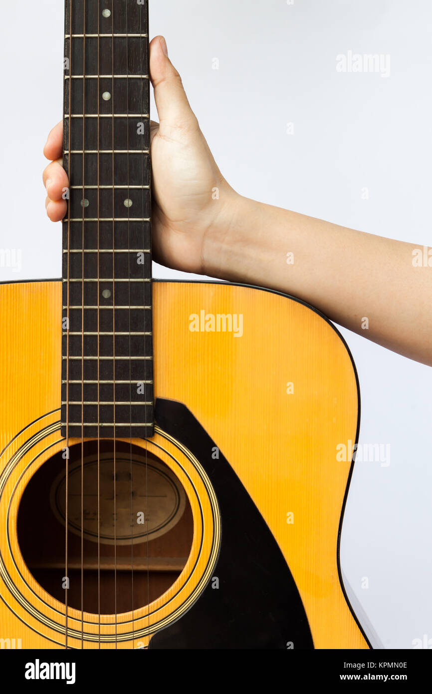 Woman's hand holding acoustic guitar on white background Stock Photo ...