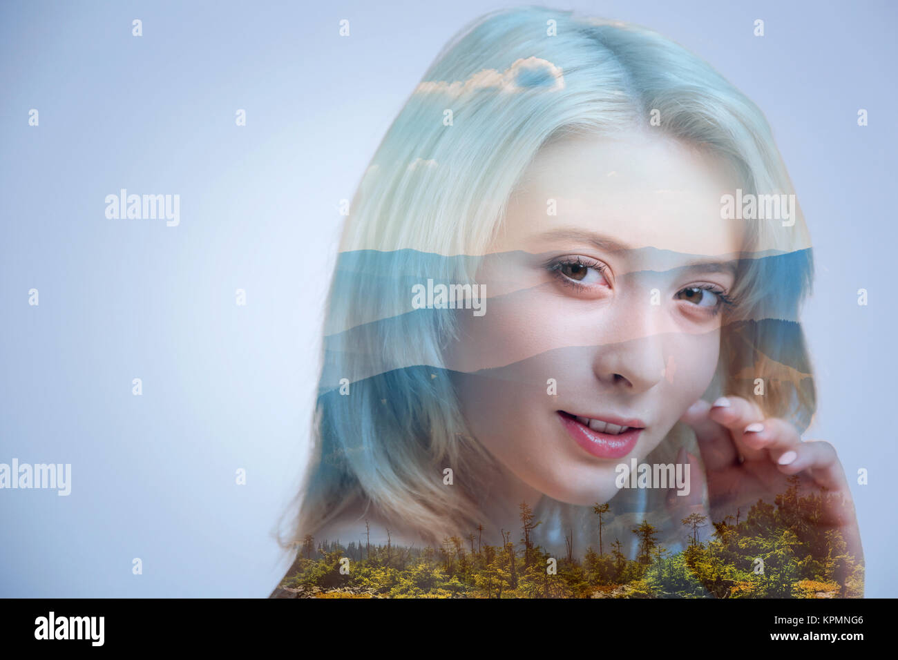 Pretty blonde girl posing for camera dreamily Stock Photo - Alamy