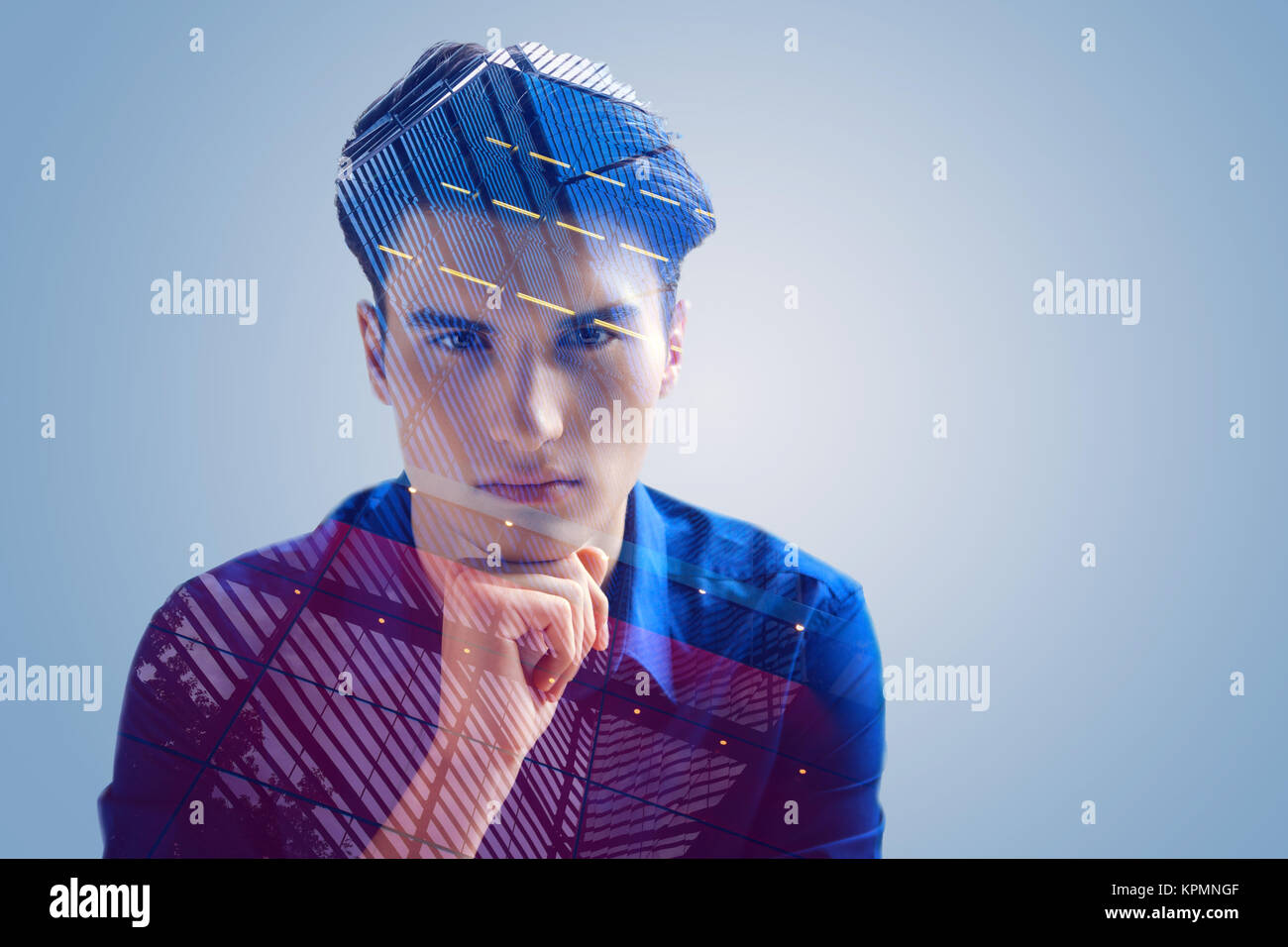 Serious guy looking into camera confidently Stock Photo - Alamy