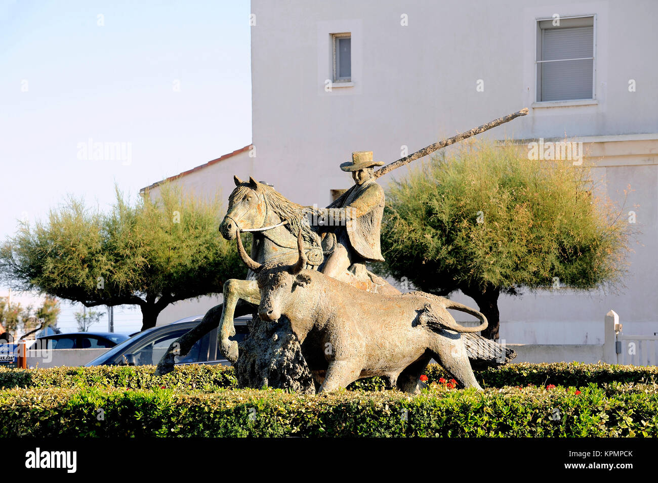 Statue of Guardian guiding a bull Stock Photo - Alamy