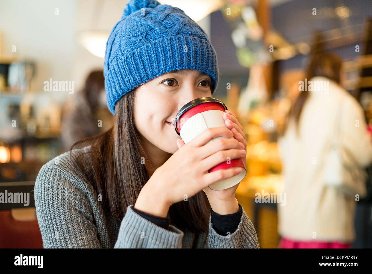 Woman having coffee in cafe Stock Photo - Alamy