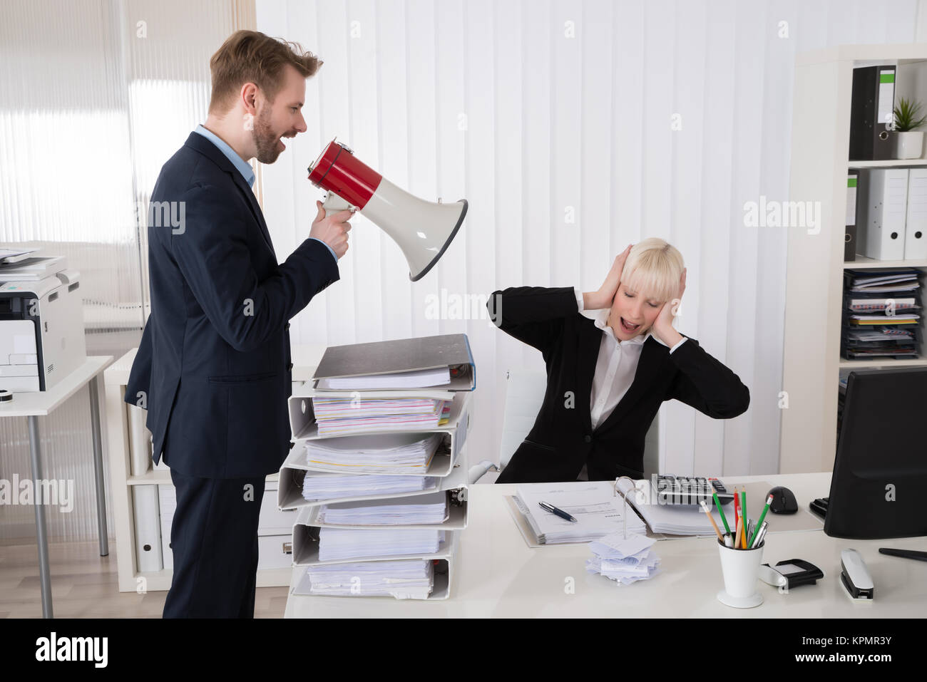 Boss Shouting At Businesswoman Through Loudspeaker Stock Photo - Alamy