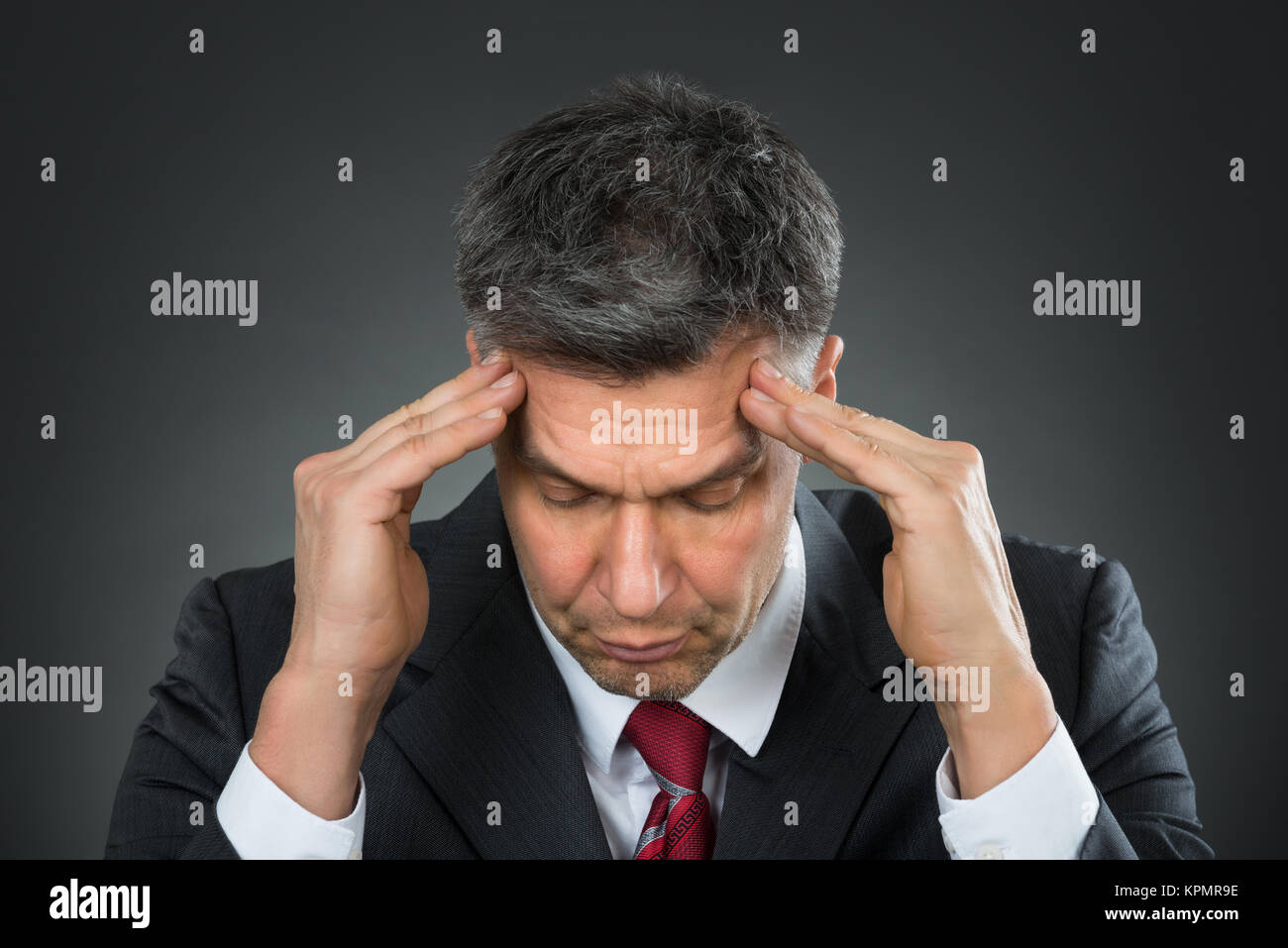 Businessman Suffering From Headache Stock Photo - Alamy
