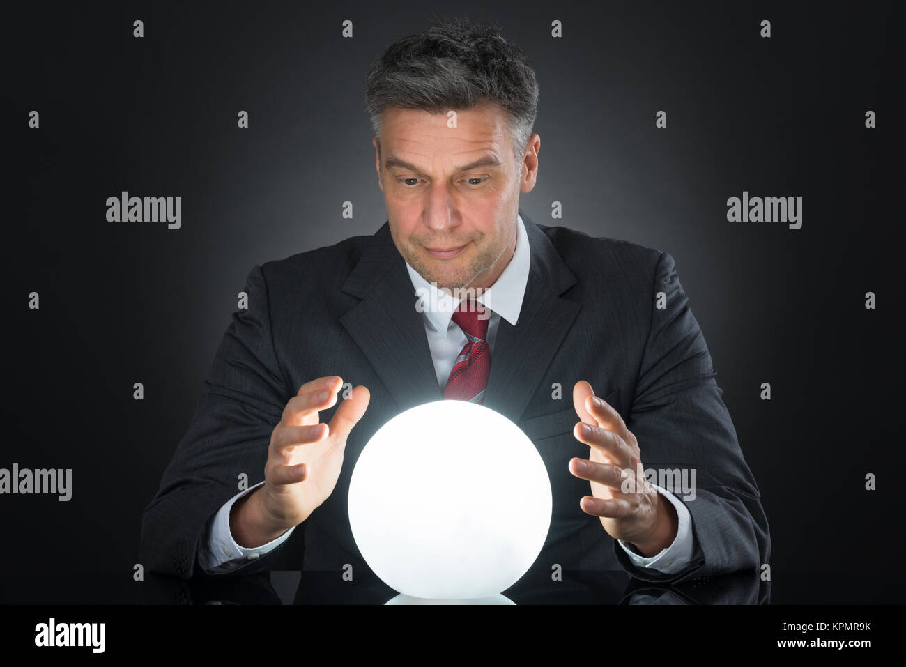 Portrait Of Businessman Predicting Future With Crystal Ball Stock Photo ...