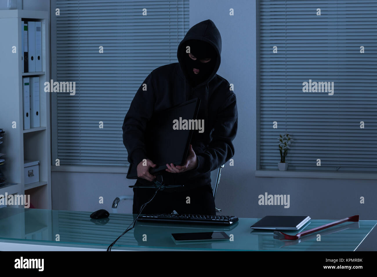 Thief Stealing Computer Stock Photo - Alamy