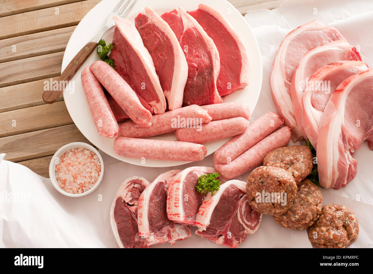 Assorted raw meat cuts with salt Stock Photo - Alamy