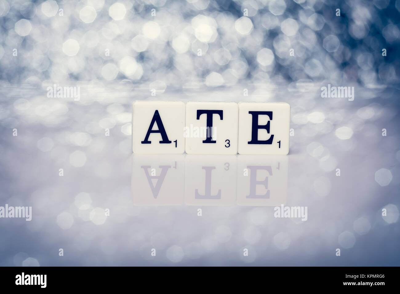Written word of tiles with letters - ate Stock Photo - Alamy
