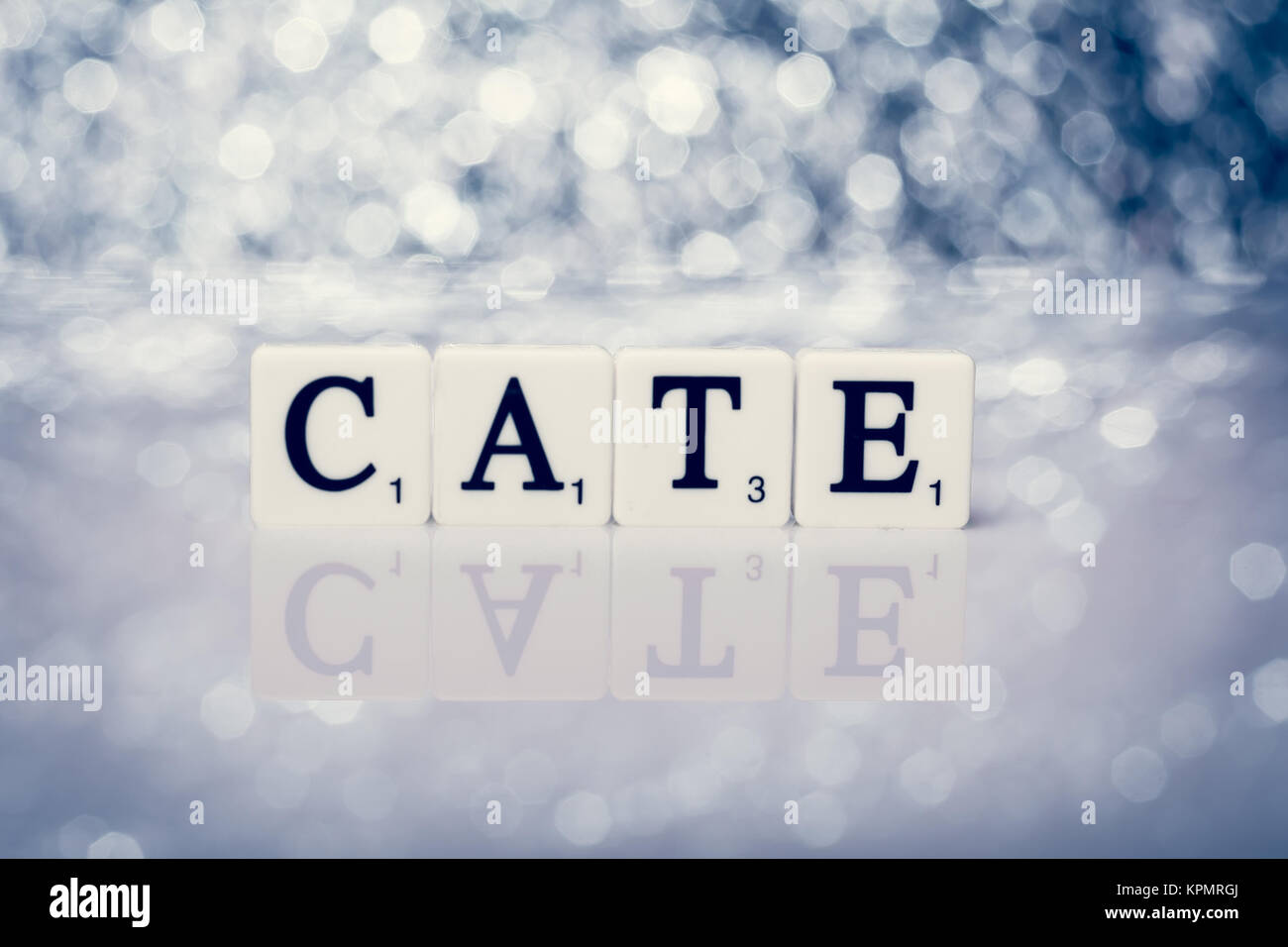 Written word of tiles with letters - cate Stock Photo - Alamy