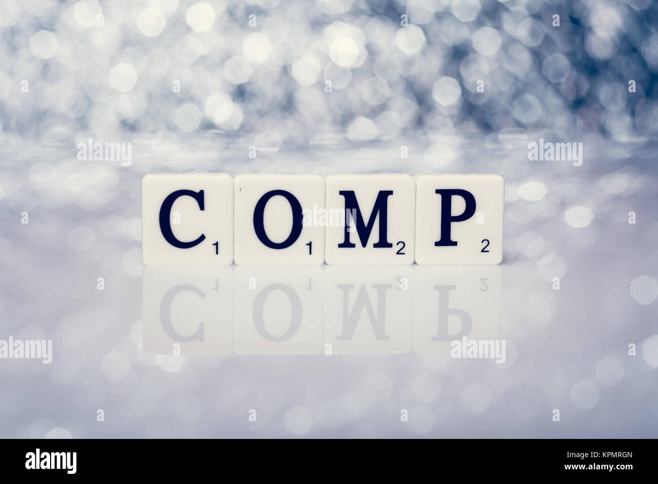 Written word of tiles with letters - comp Stock Photo - Alamy