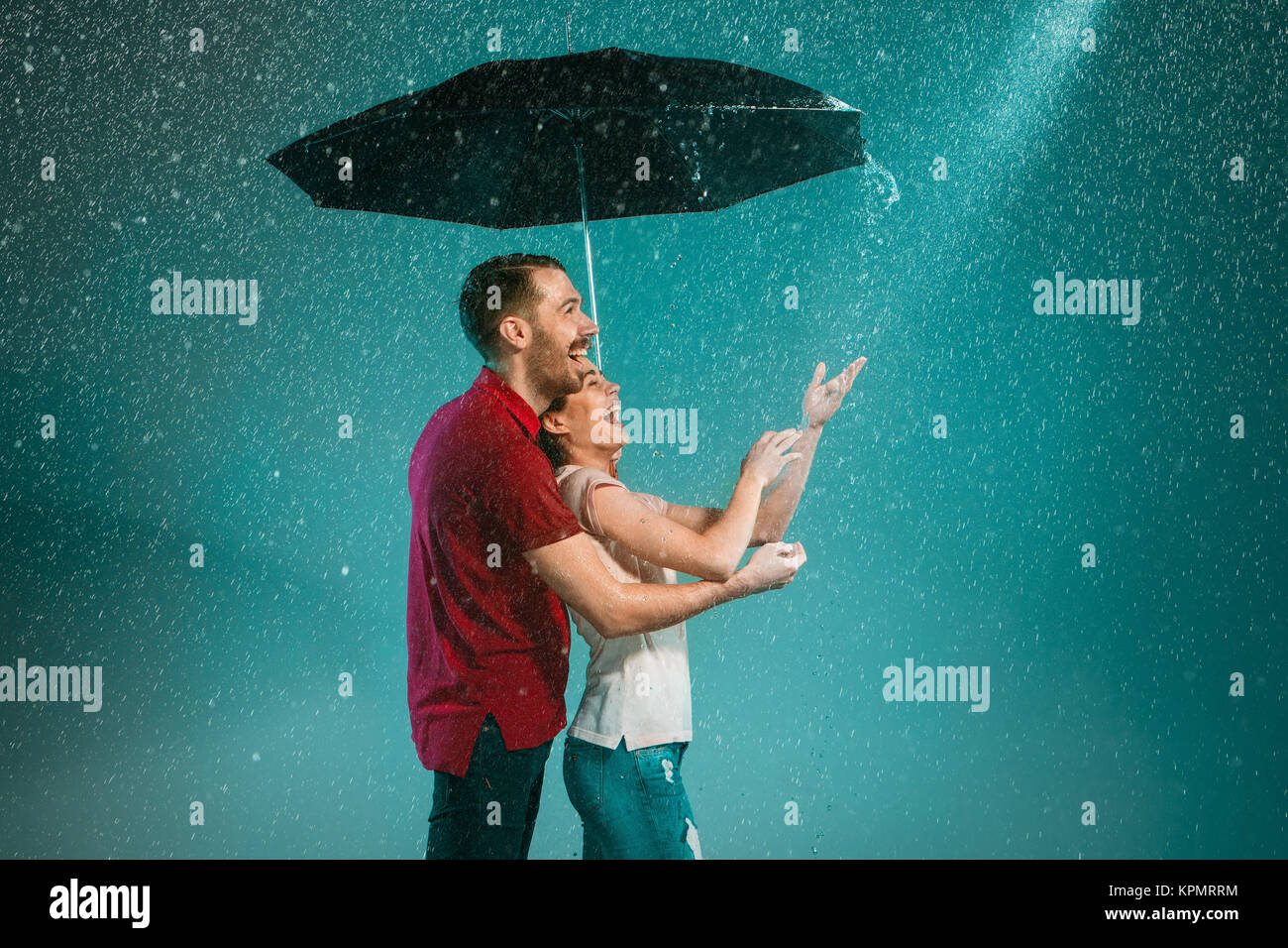 The loving couple in the rain Stock Photo - Alamy