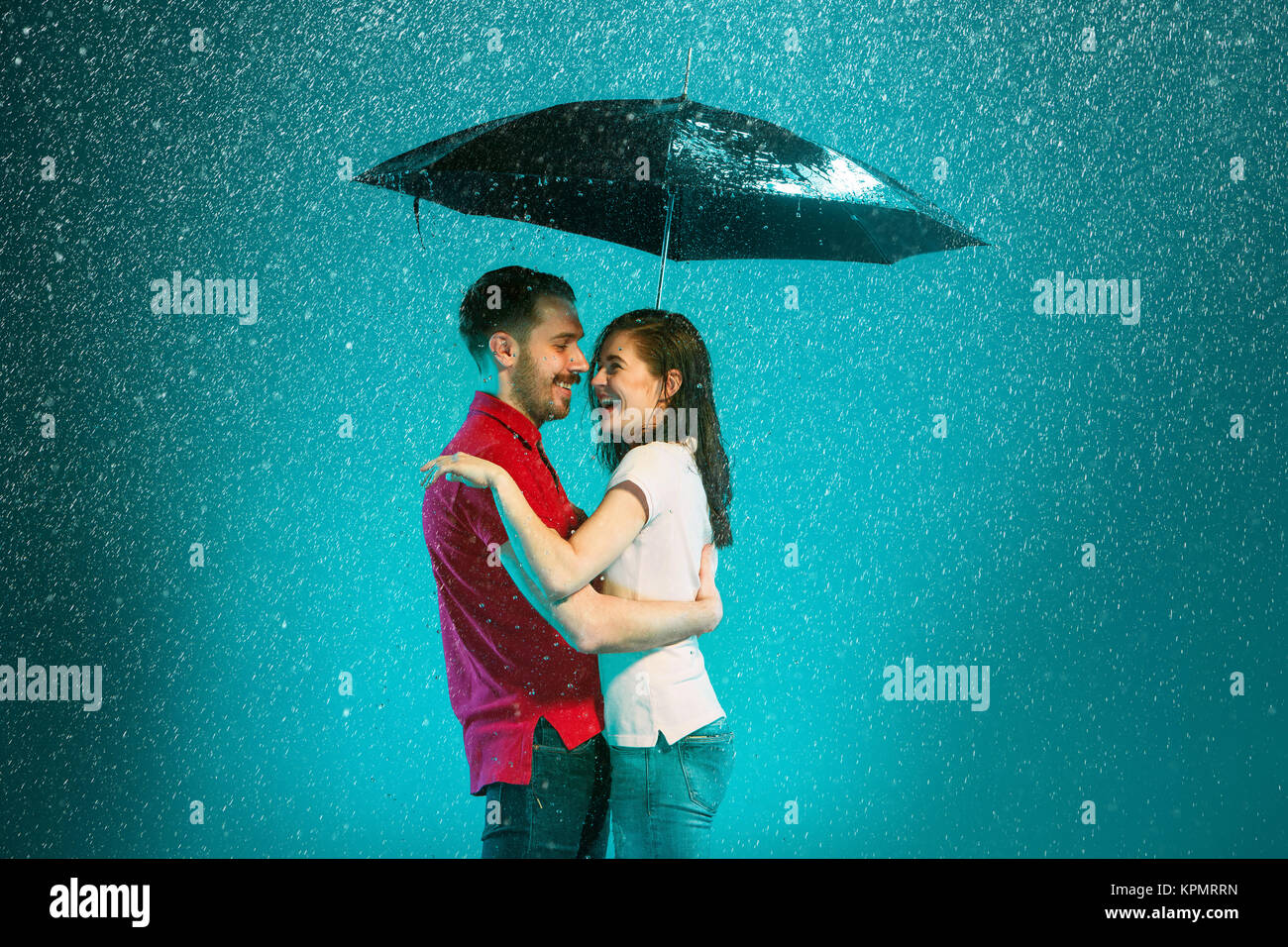 The loving couple in the rain Stock Photo - Alamy