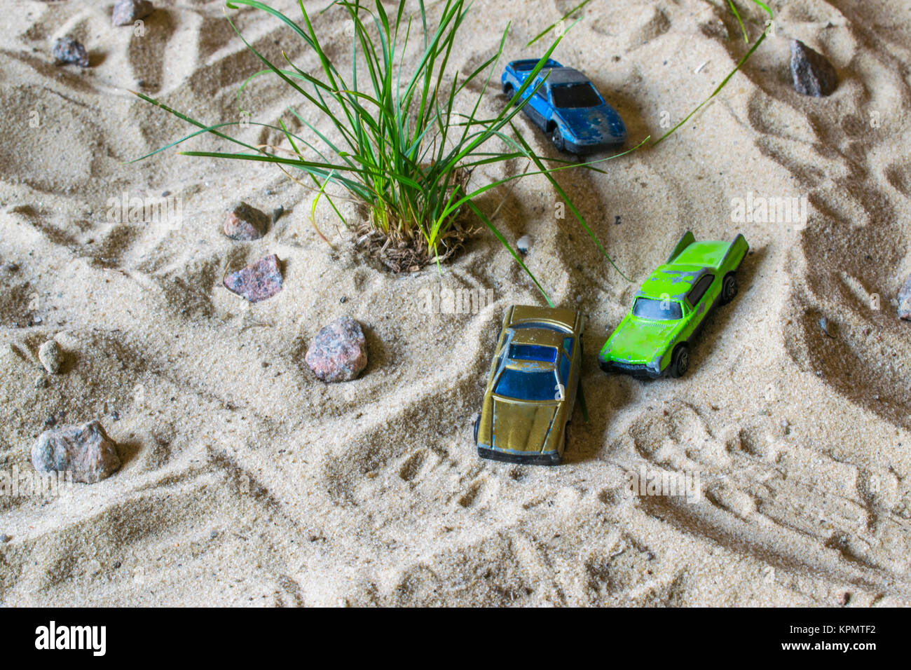 Racing cars on the sand compete in a game of survival. Almost collided ...