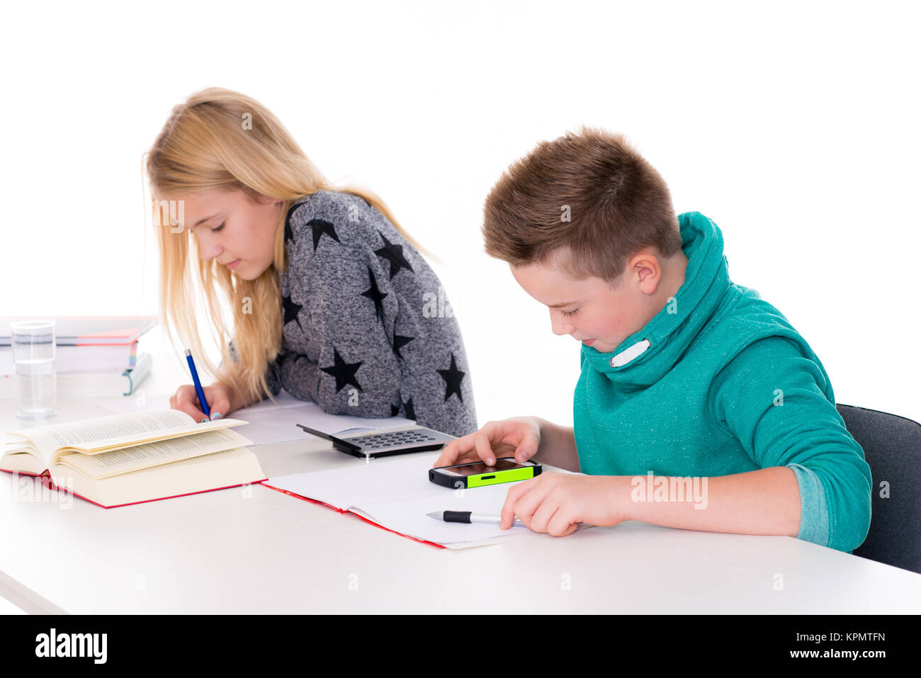 girl and boy learning together in the classroom Stock Photo - Alamy