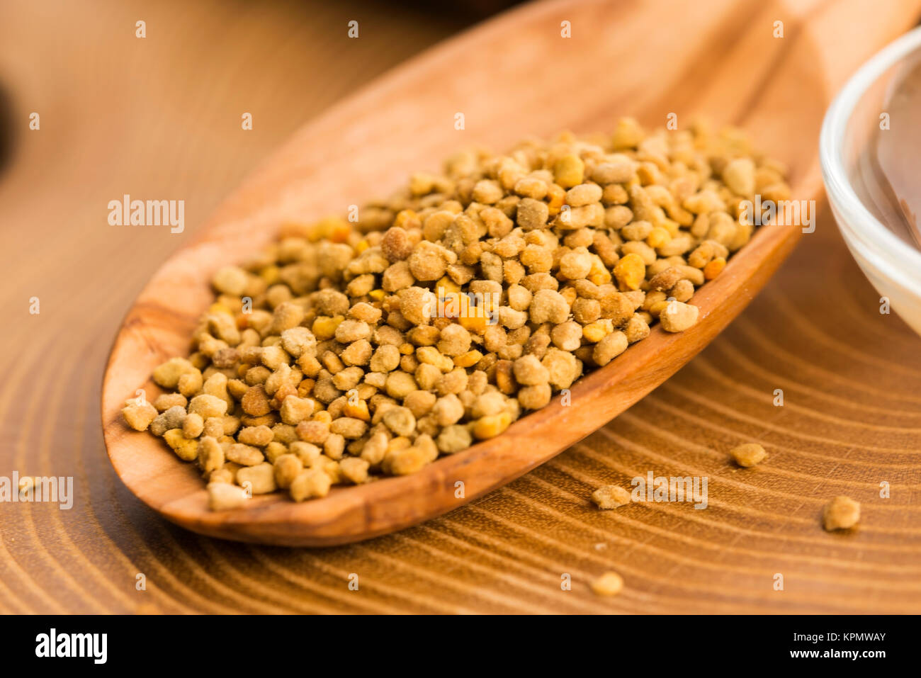Fresh bee pollen in the spoon with honeycomb Stock Photo - Alamy
