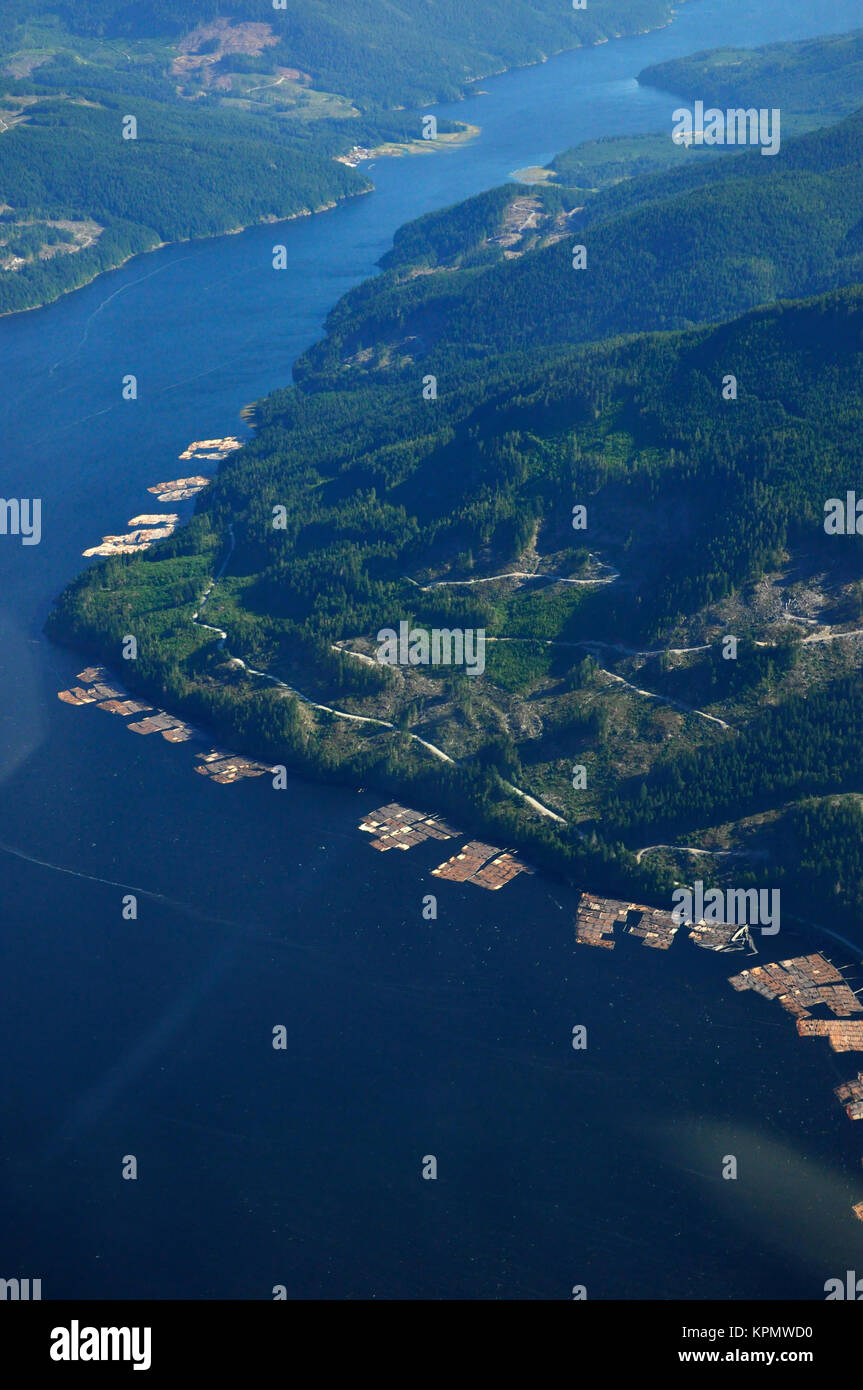 Logged Timber in a port with an aerial Island View of Vancouver Island ...
