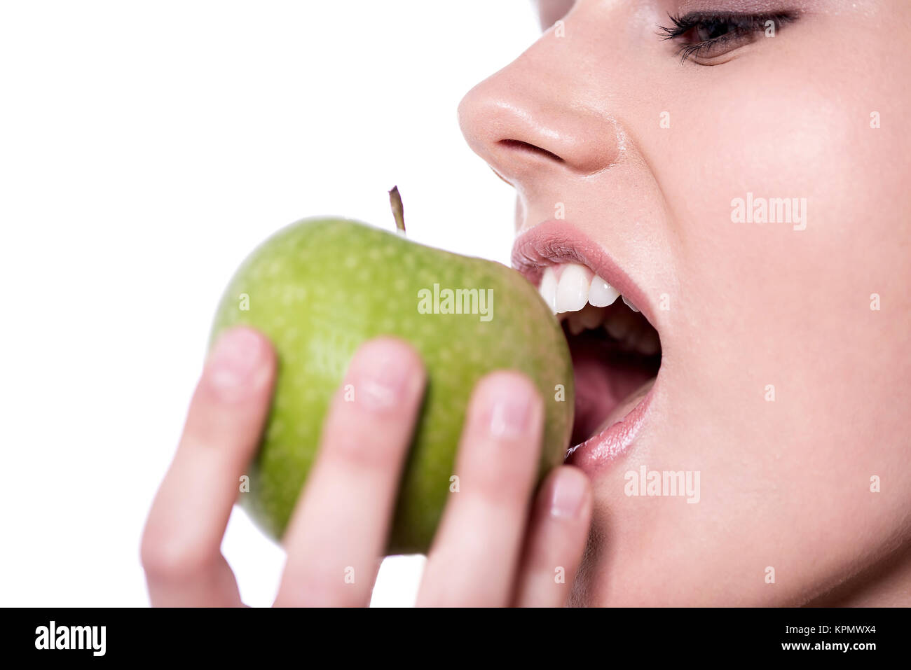 Woman eating an apple Stock Photo - Alamy