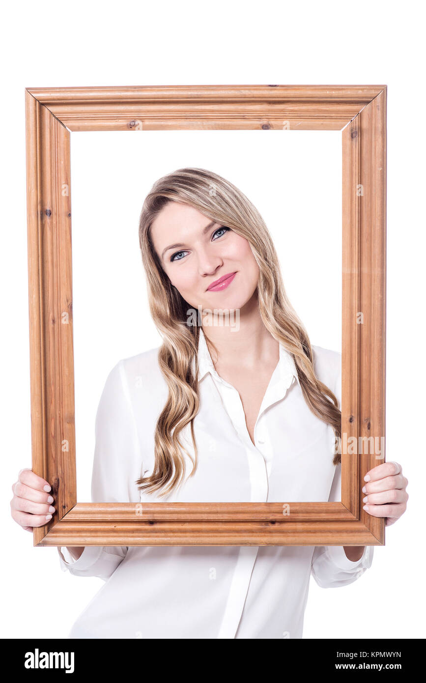 Pretty woman posing behind wooden frame Stock Photo - Alamy
