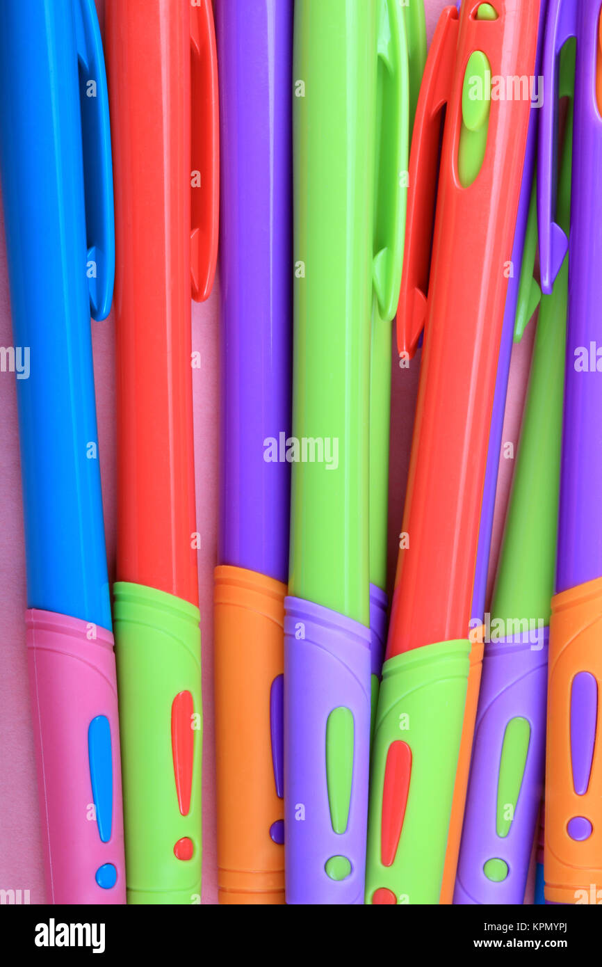 many Ball Pen on Pink Background Stock Photo - Alamy