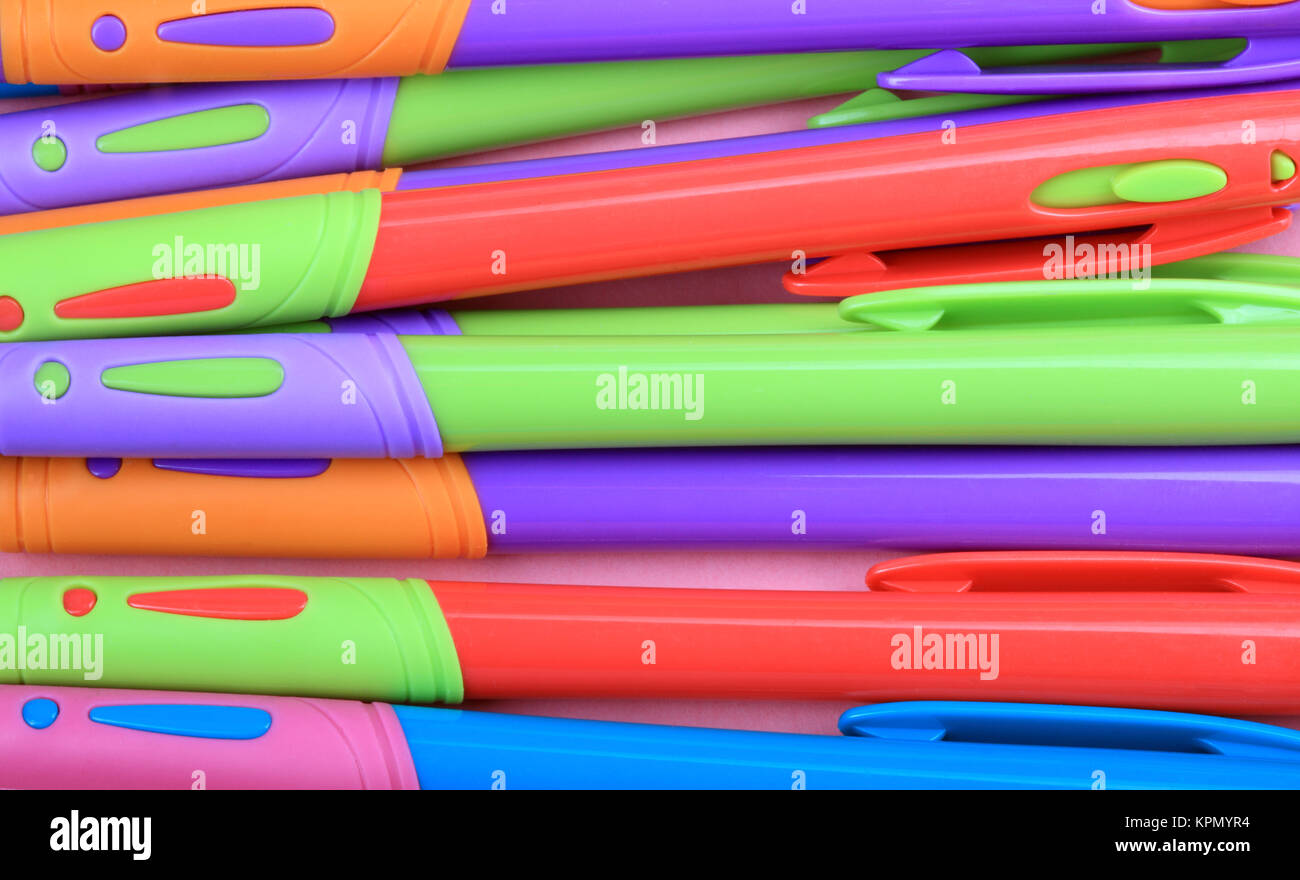 many Ball Pen on Pink Background Stock Photo - Alamy