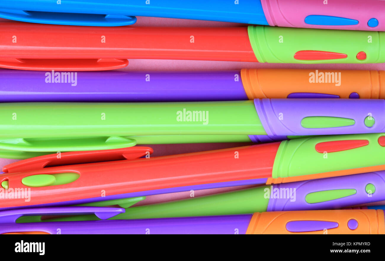 many Ball Pen on Pink Background Stock Photo - Alamy