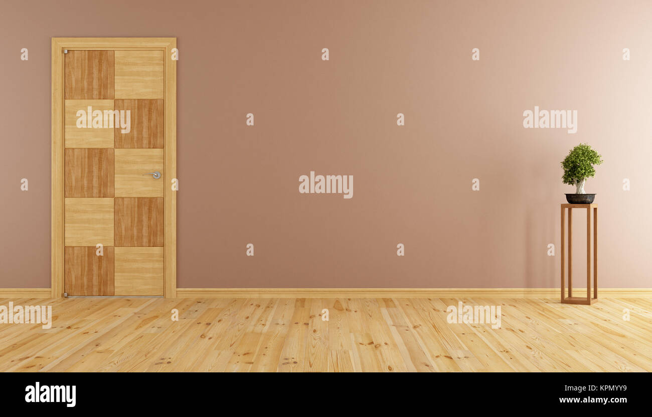 Empty room with wooden door Stock Photo - Alamy