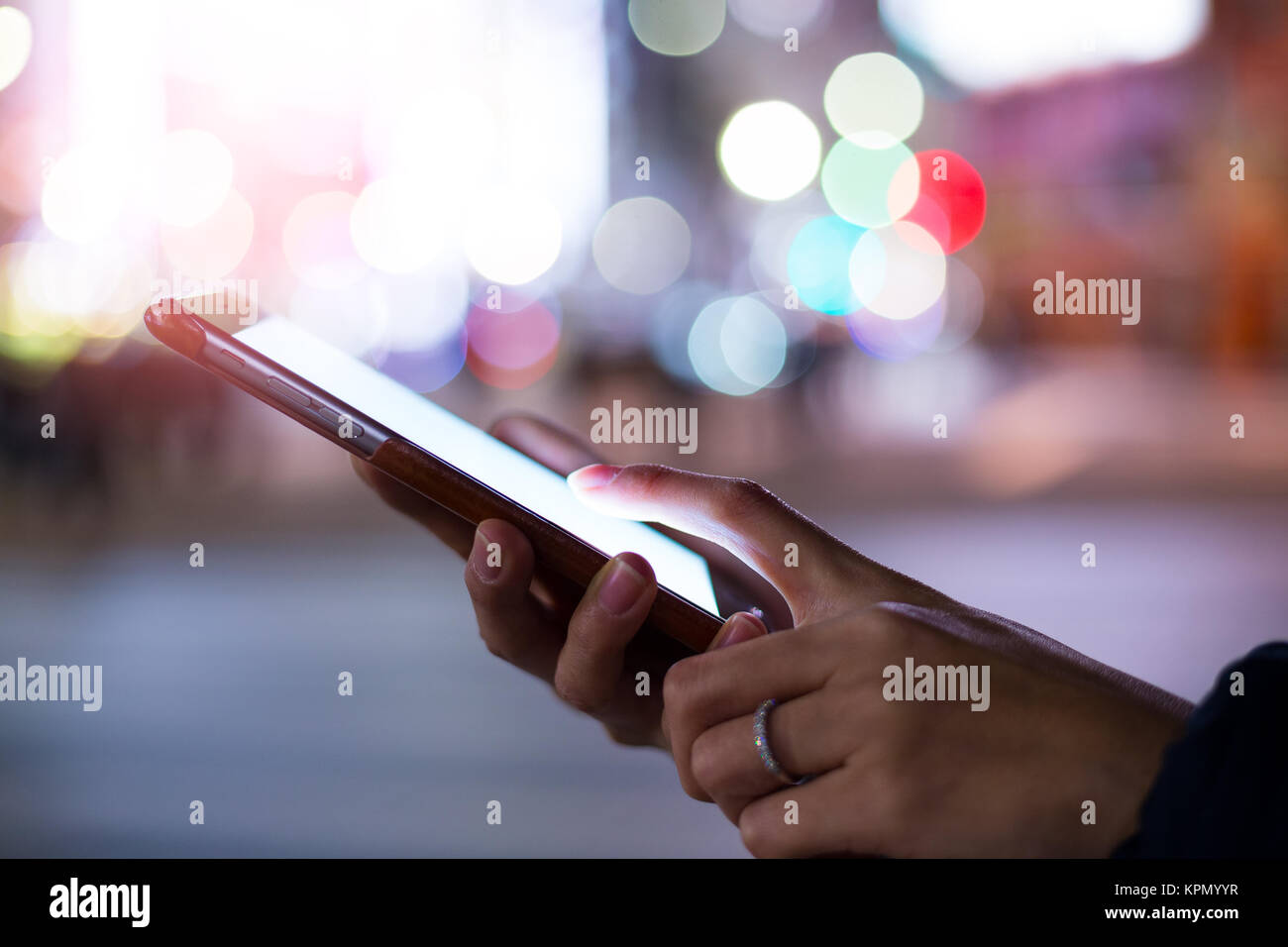 Woman using cellphone at night Stock Photo - Alamy
