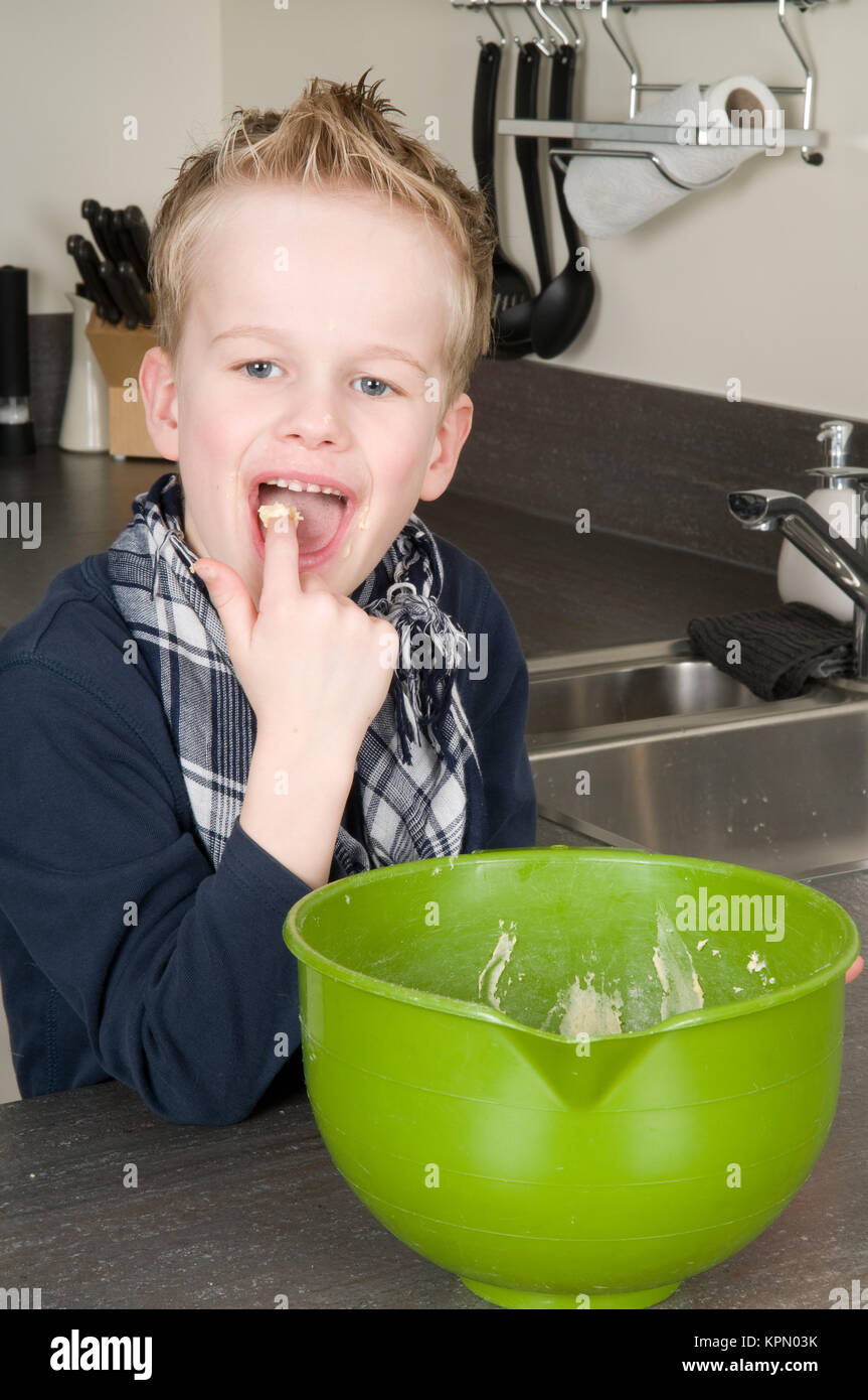 Boy Eating Dough Stock Photo - Alamy