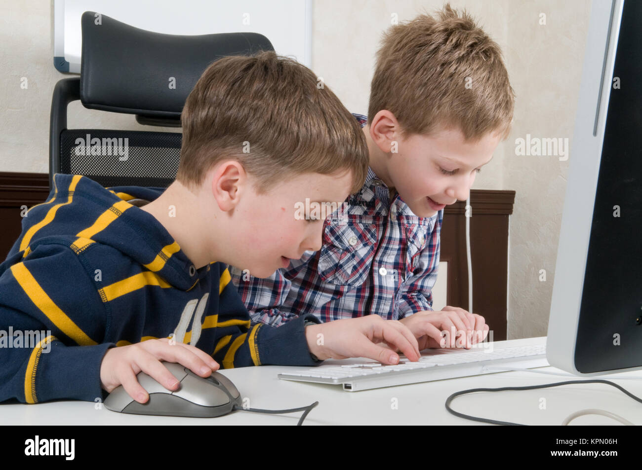 Boys on a computer Stock Photo - Alamy