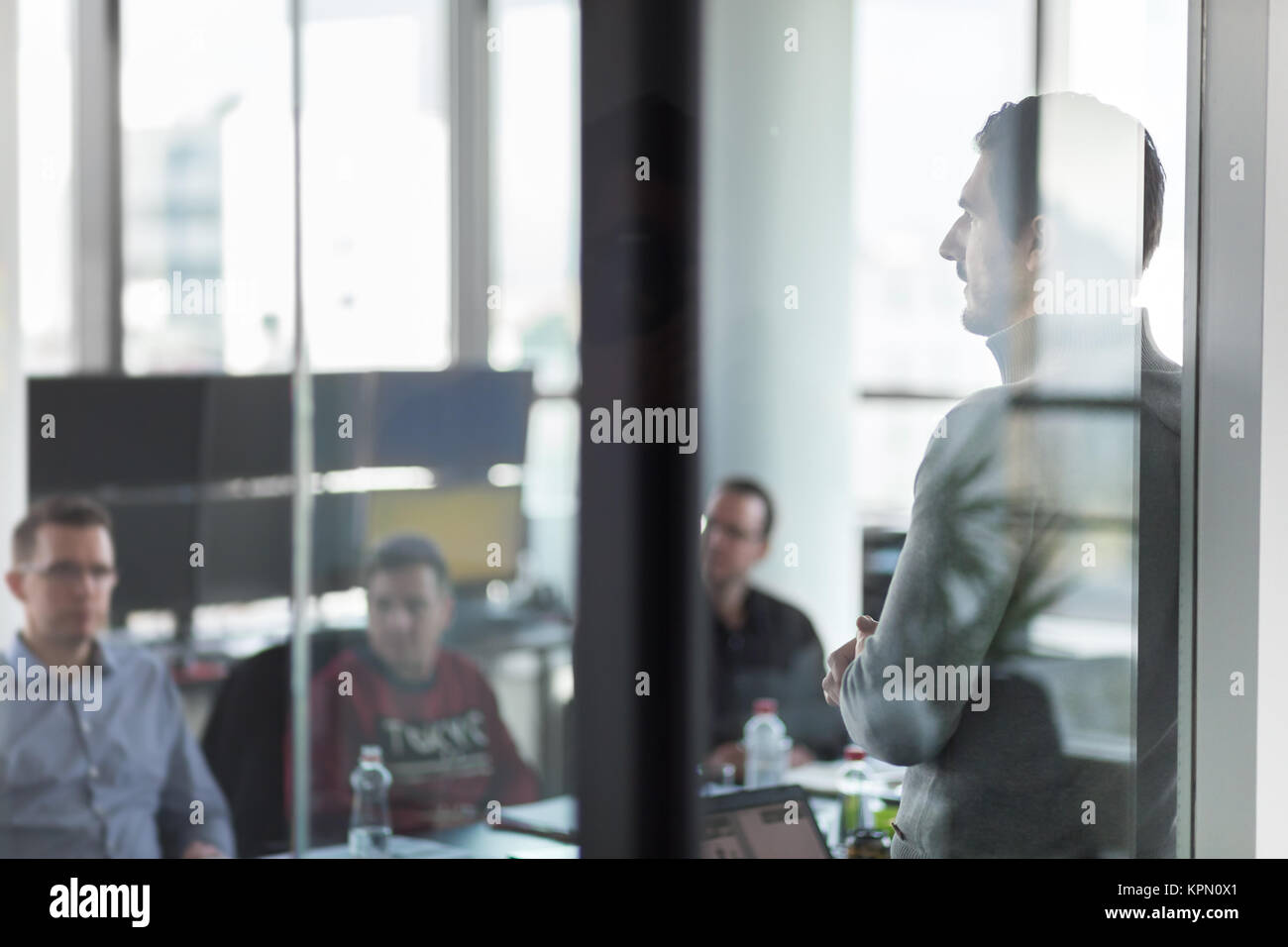 Business team leader delivering presentation in office Stock Photo - Alamy