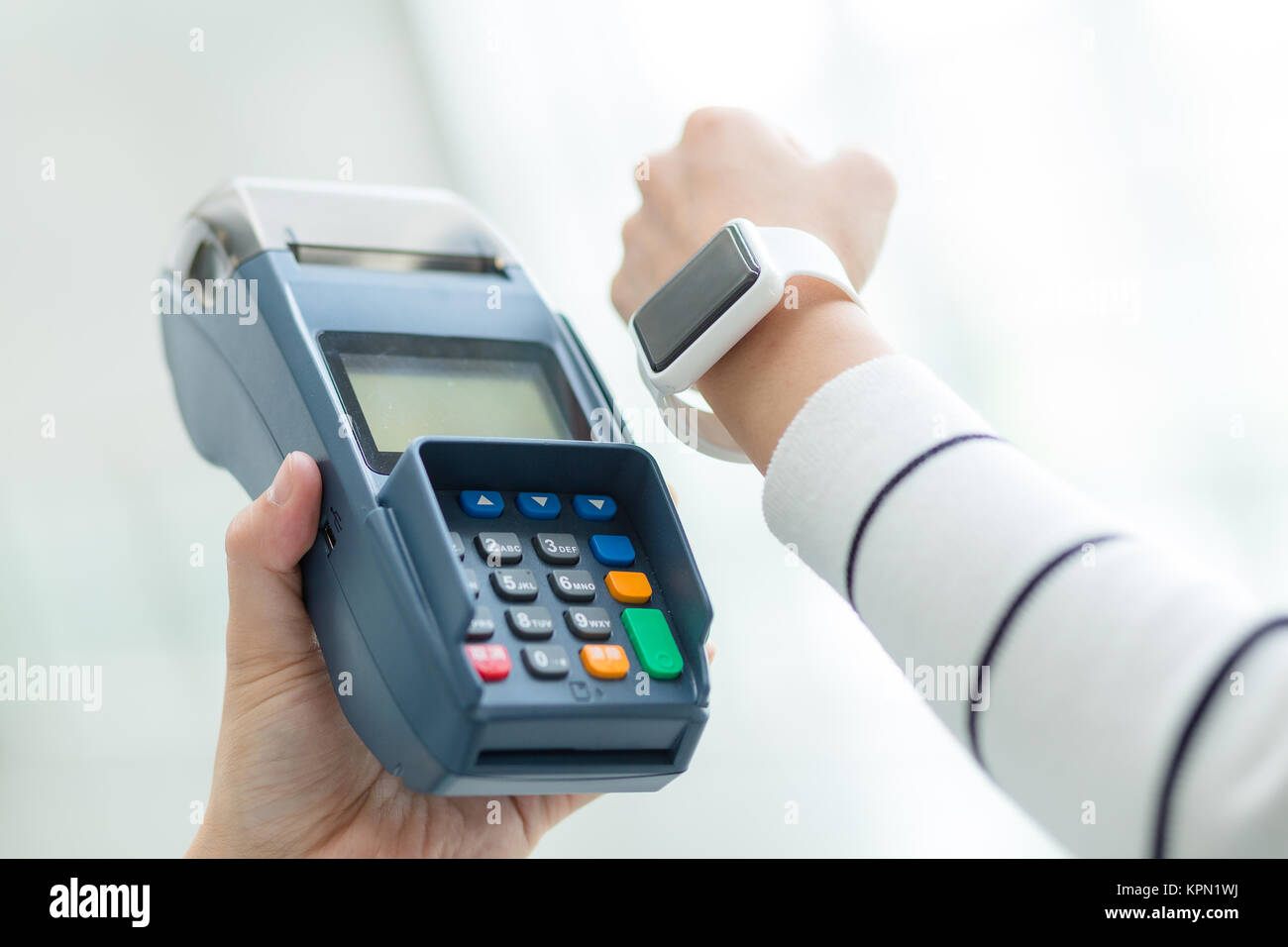 Woman pay by smart watch with NFC technolgoy Stock Photo - Alamy