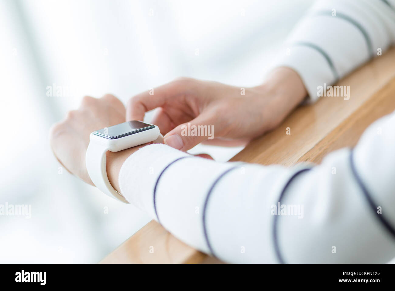 Woman use of smartwatch Stock Photo - Alamy