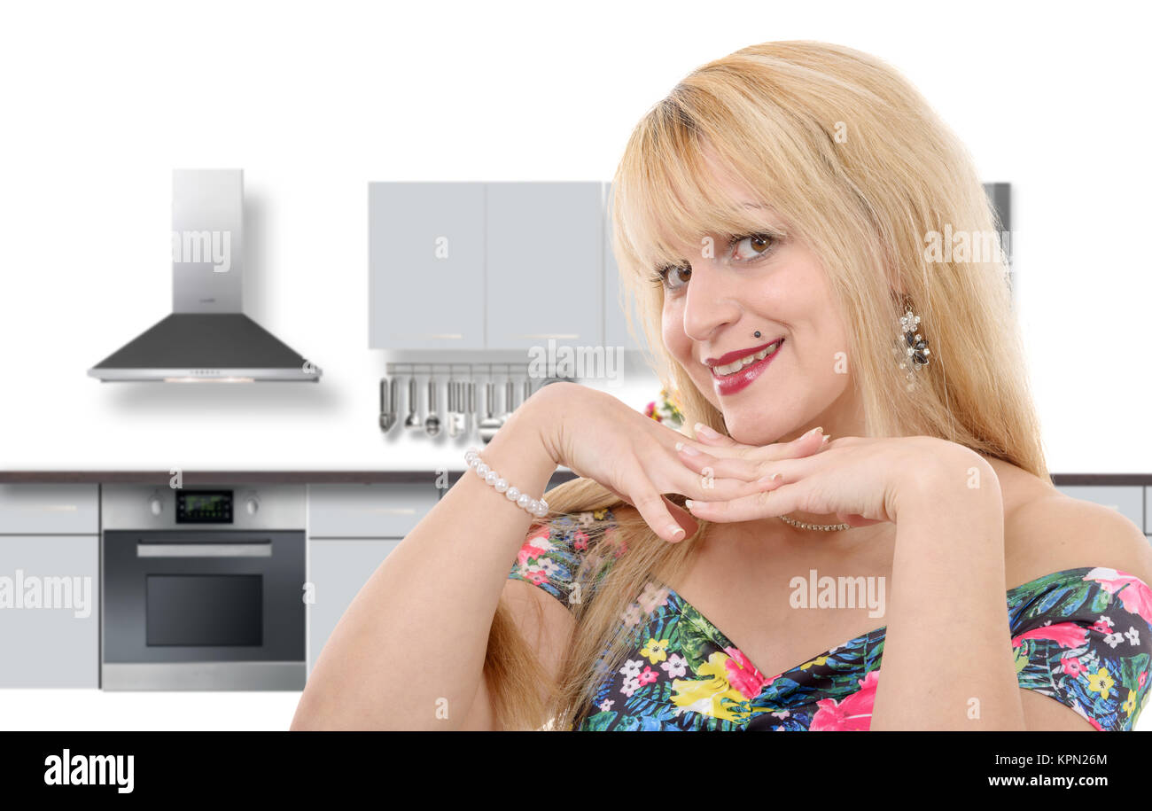 Portrait of smiling young housewife in modern kitchen Stock Photo - Alamy