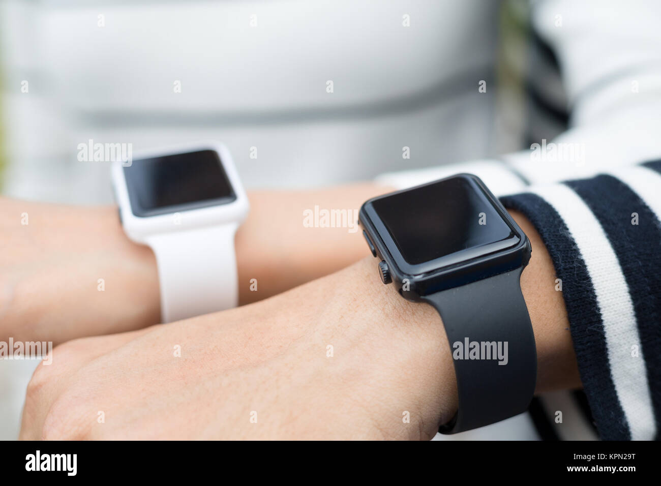 Couple wearing smartwatch together Stock Photo - Alamy