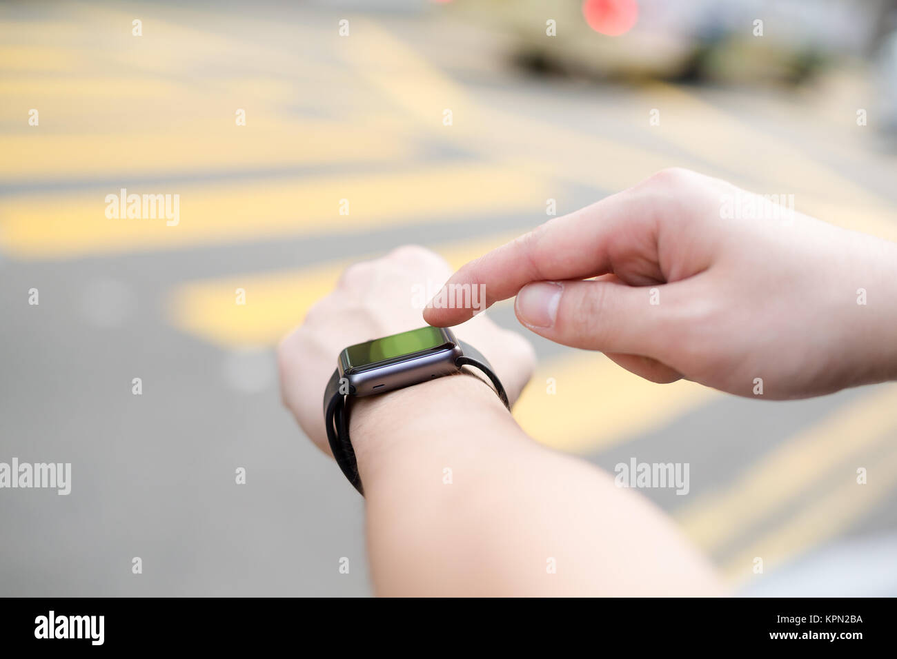 Man pointing on smart watch Stock Photo - Alamy