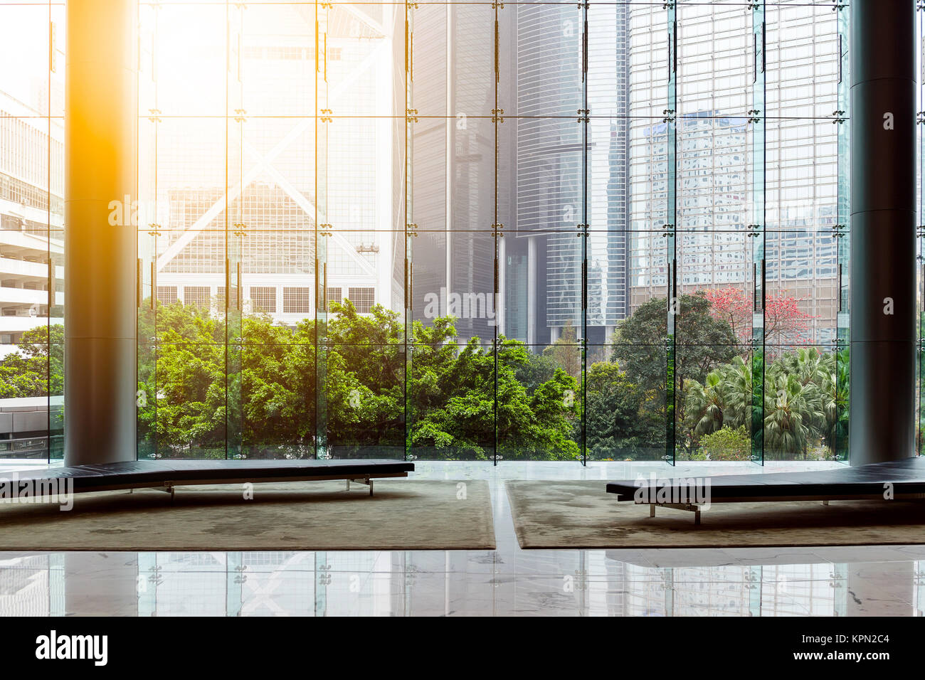 Office building with glass wall Stock Photo - Alamy