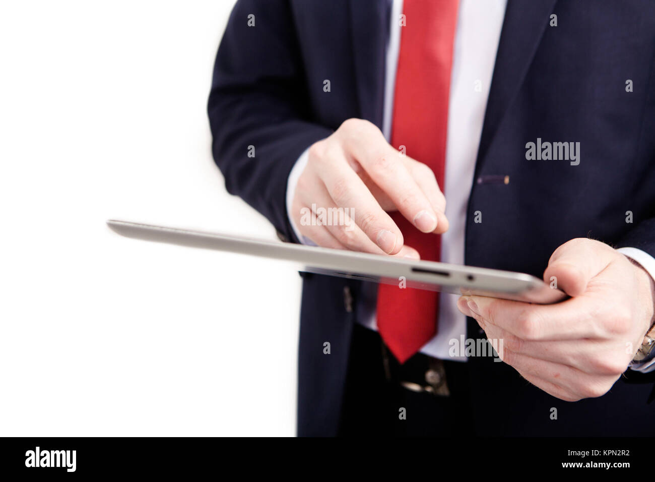 Businessman standing posture hand holding blank tablet isolated on over ...