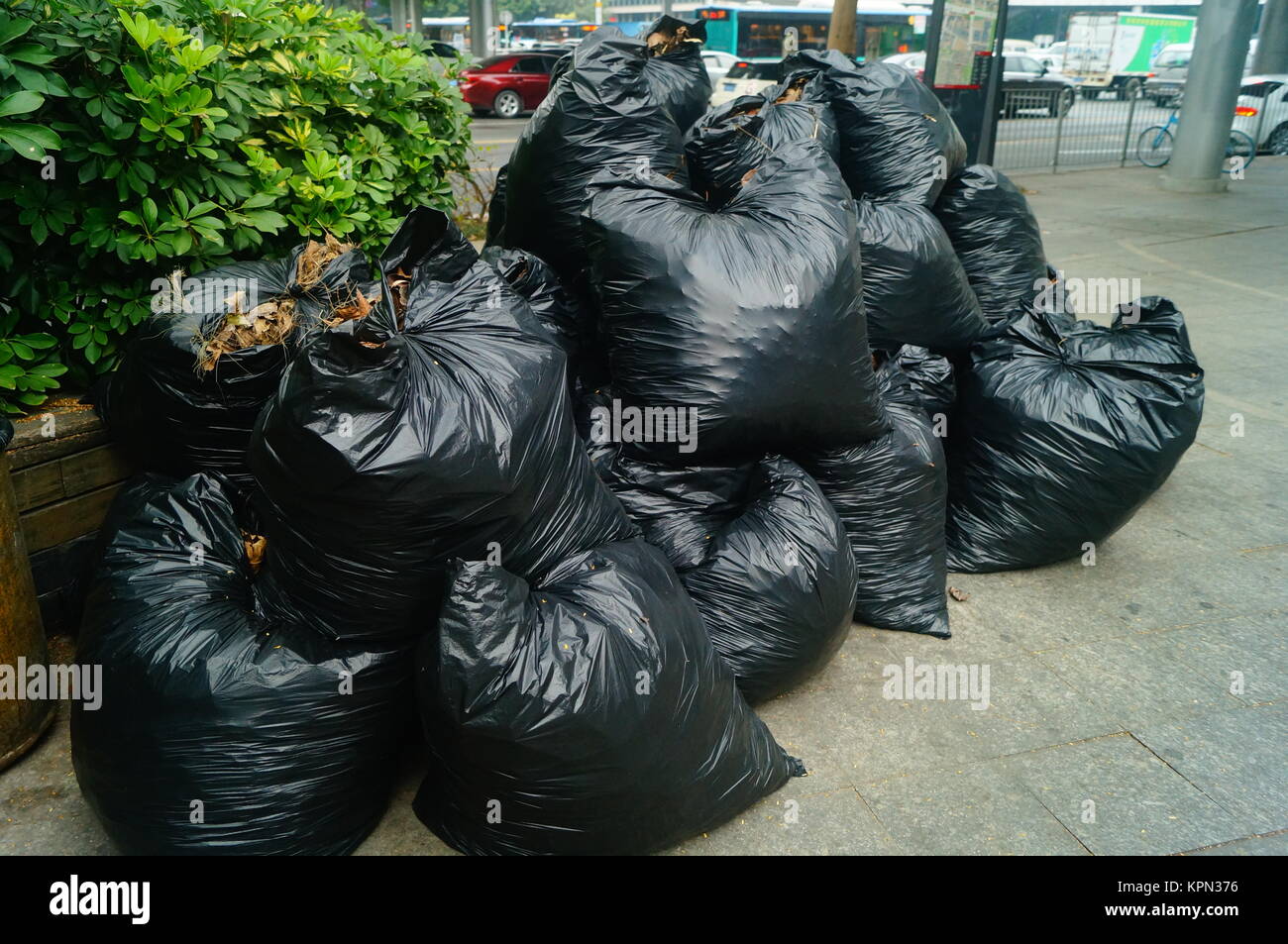 Black plastic bags filled with garbage, heaps of heaps, on the city ...